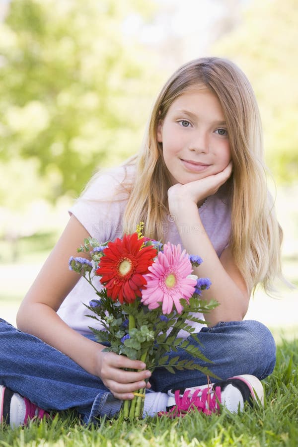 Young girl holding flowers stock image. Image of girl - 5944373
