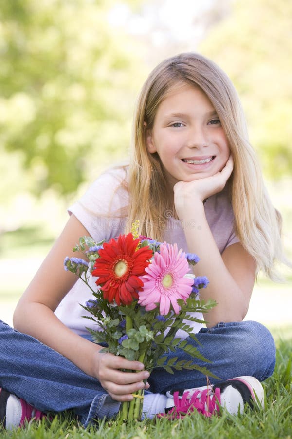 Young Girl Holding Flowers Stock Images - Image: 5944374 Young Girl Holding Flowers Stock Images - Image: 5944374