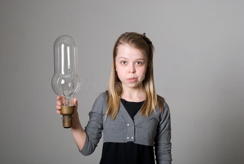 A Young Girl Holding a Large Bulb Stock Image - Image of imagination ...