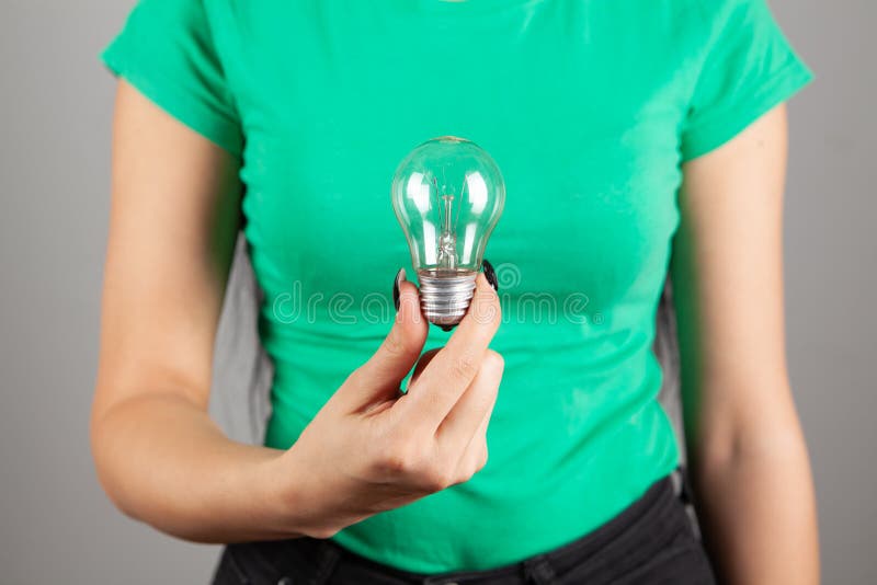 Young Girl Holding a Light Bulb Stock Photo - Image of light, bulb ...