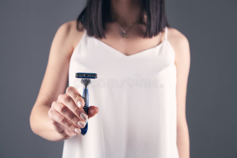 Young girl holding a razor stock image. Image of clean - 235645939