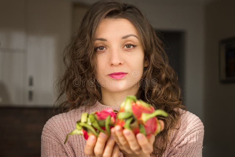 Young Girl Is Holding Two Fresh Ripe Organic Dragon Fruits Or Pitaya