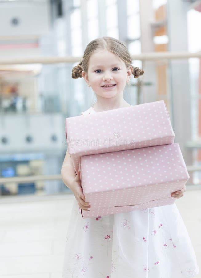 Young Girl Holding Two Gift Wrapped Boxes Stock Photo - Image of ...