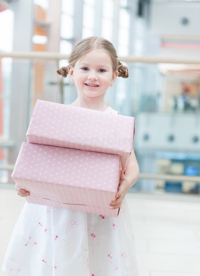 Young Girl Holding Two Gift Wrapped Boxes Stock Image - Image of female ...