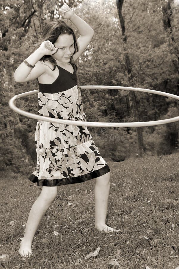 Young girl with hula hoop stock photo. Image of barefoot - 9182272