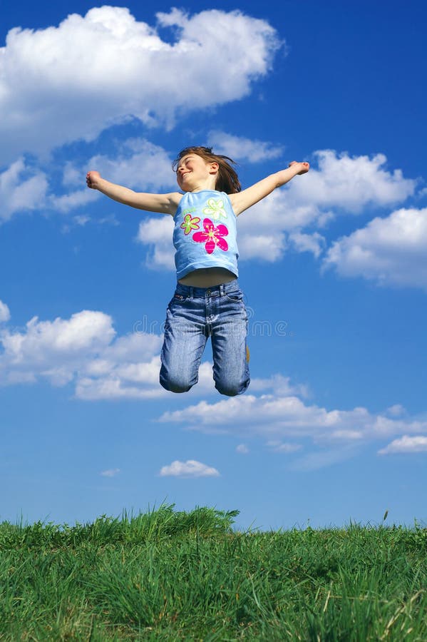 Young girl jumping stock photo. Image of meadow, smiling - 2271012