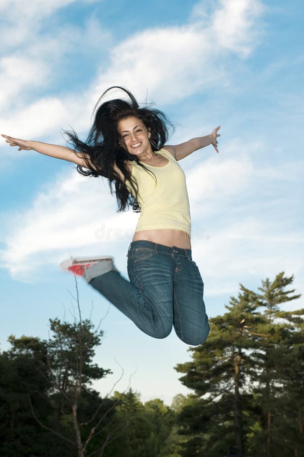 Young girl jumping stock photo. Image of gorgeous, outside - 9926196