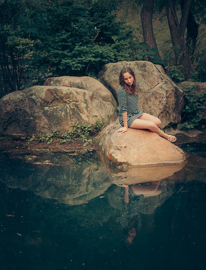 Young girl on the lake stock image. Image of happiness - 62940803