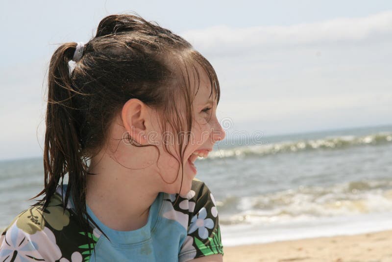 Young Girl Laughing on the Beach Stock Image - Image of surf, holiday ...