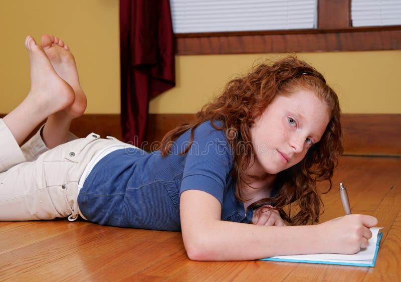 Young Girl Laying on the Floor Writing Stock Image - Image of letters ...