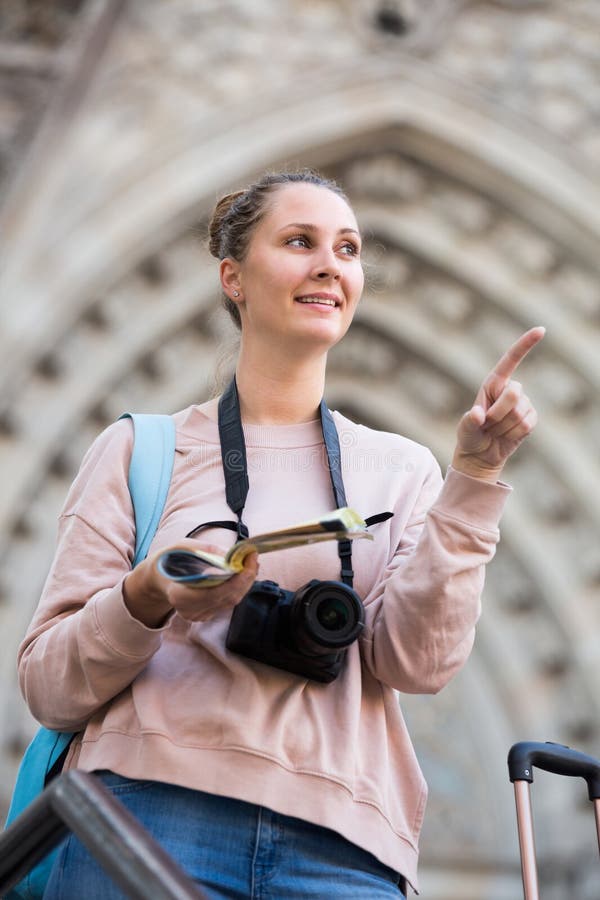 Young Girl is Leafing through the Booklet Stock Image - Image of guide ...
