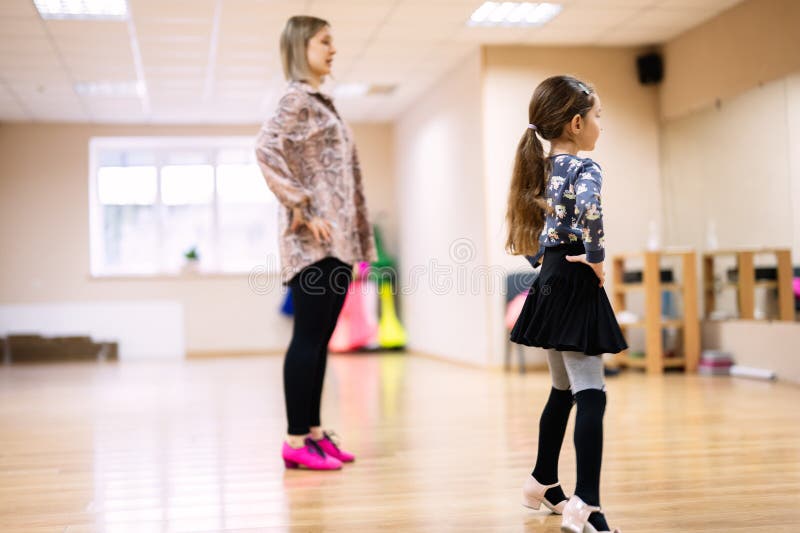 Little Girl Practicing Dance Moves with Instructor in Dance Studio ...