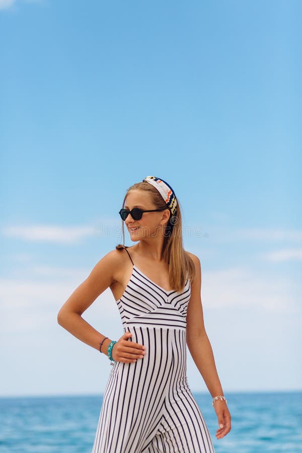 Young Girl Looking at the Sea Standing on the Beach Stock Image - Image ...
