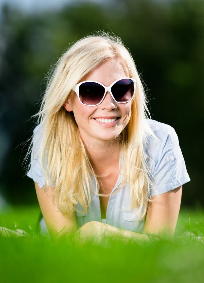 Young Girl Lying on the Grass Stock Photo - Image of green, blonde ...