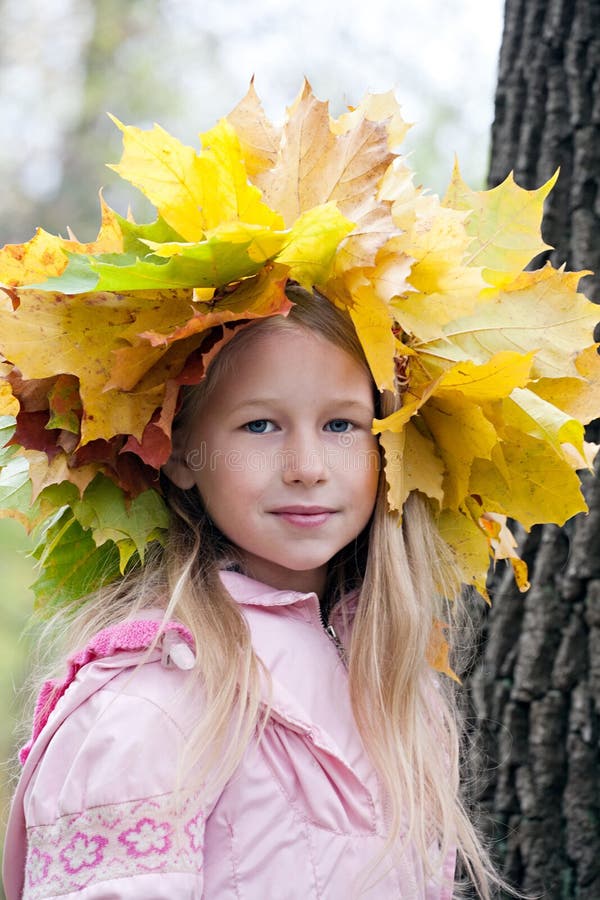 Young girl in maple wreath stock image. Image of face - 68142981