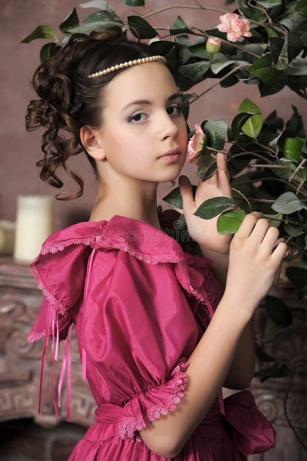 The Young Girl in a Medieval Dress with a Rose Stock Image - Image of ...