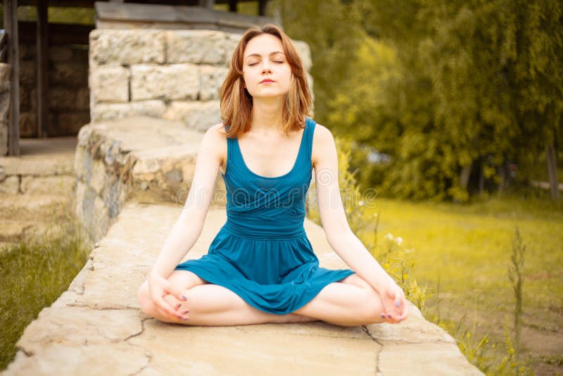 Young Girl Meditates on the Stone Wall of the Castle Stock Image ...