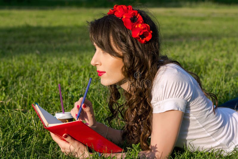 Young Girl with a Notepad Pen and a Cup of Coffee in a Summer Pa Stock ...