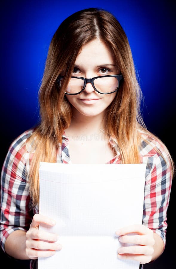 Young Woman Biting a Nerd Glasses with Interested Look Stock Image ...
