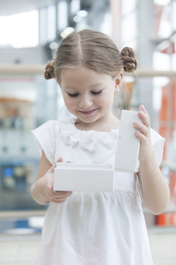 Young Girl Opens White Box and Looks into it Stock Image - Image of ...
