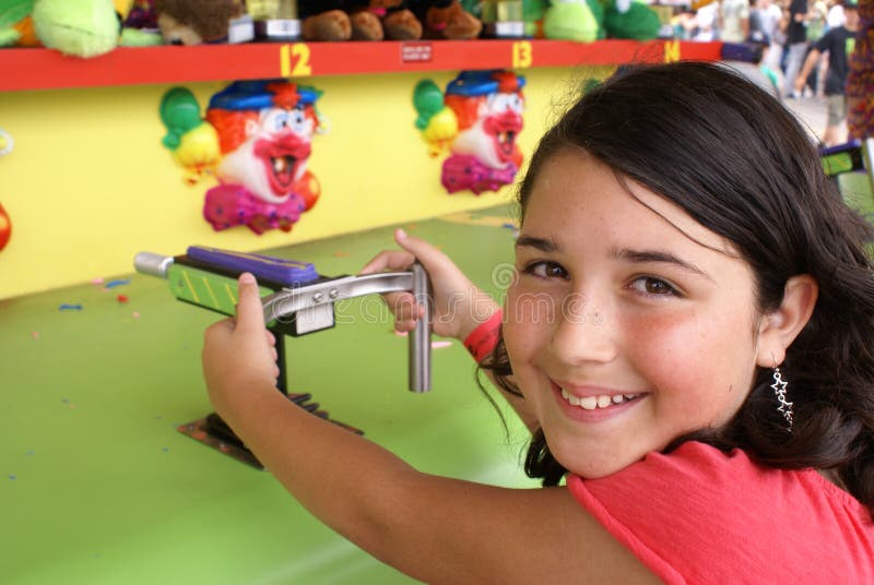 Young Girl Playing a Game at Fair or Carnival Stock Photo - Image of ...