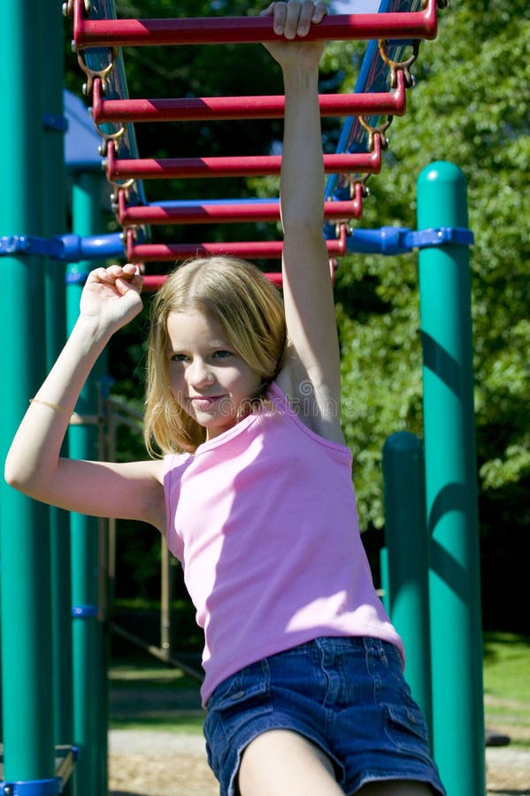 Young Girl Playing on Monkey Bars at the Park Stock Image - Image of ...