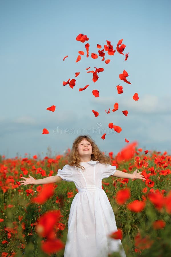 Young girl in poppy field stock image. Image of person - 80314467