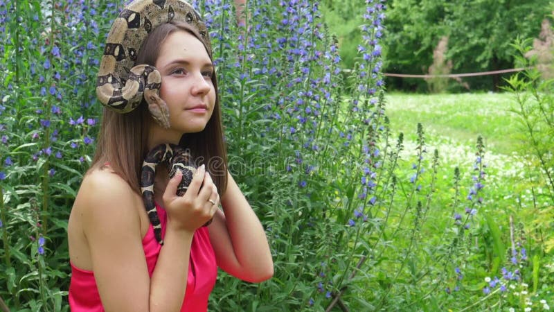 Young Girl Posing with a Snake Around His Neck on the Nature Stock ...