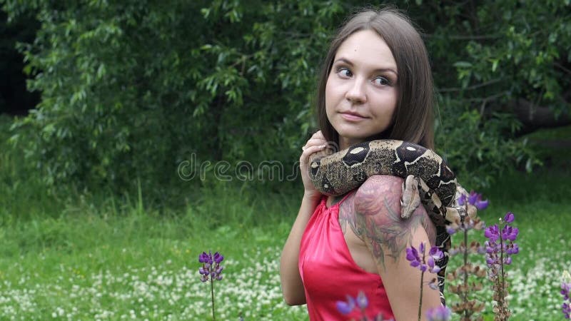 Young Girl Posing with a Snake Around His Neck on the Nature Stock ...