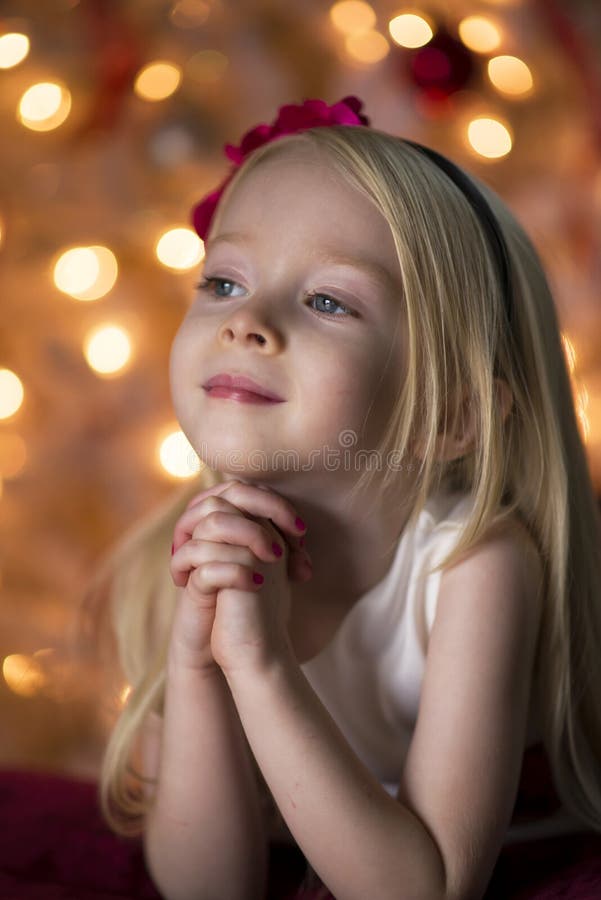 Young girl Praying stock photo. Image of lights, prayer - 28116866