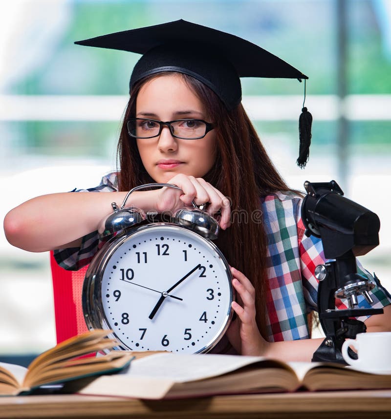 Young Girl Preparing for Exams with Large Clock Stock Photo - Image of ...