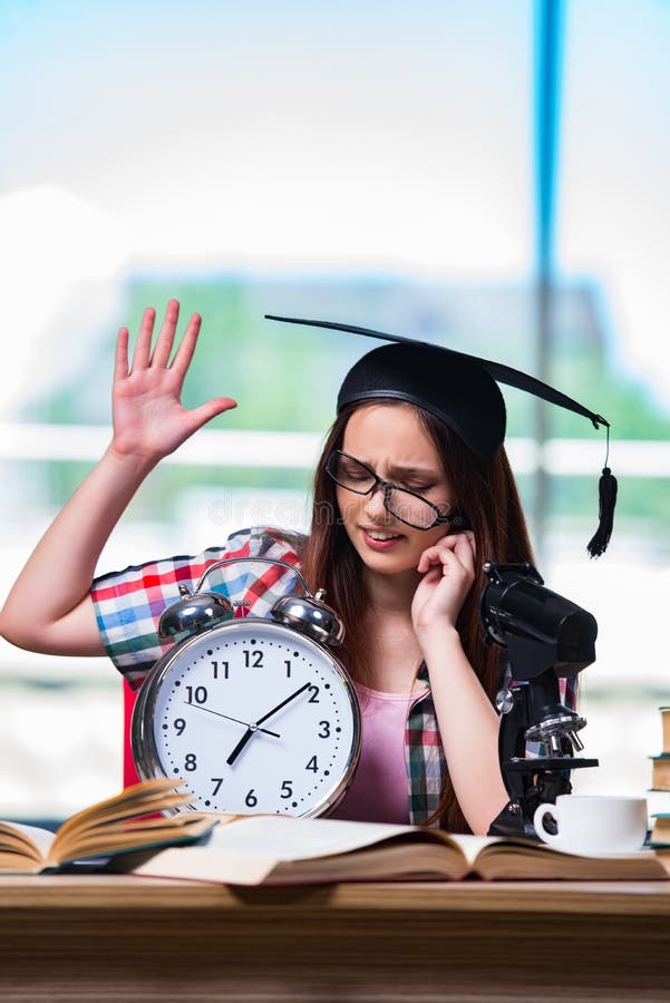 The Young Girl Preparing for Exams with Large Clock Stock Image - Image ...