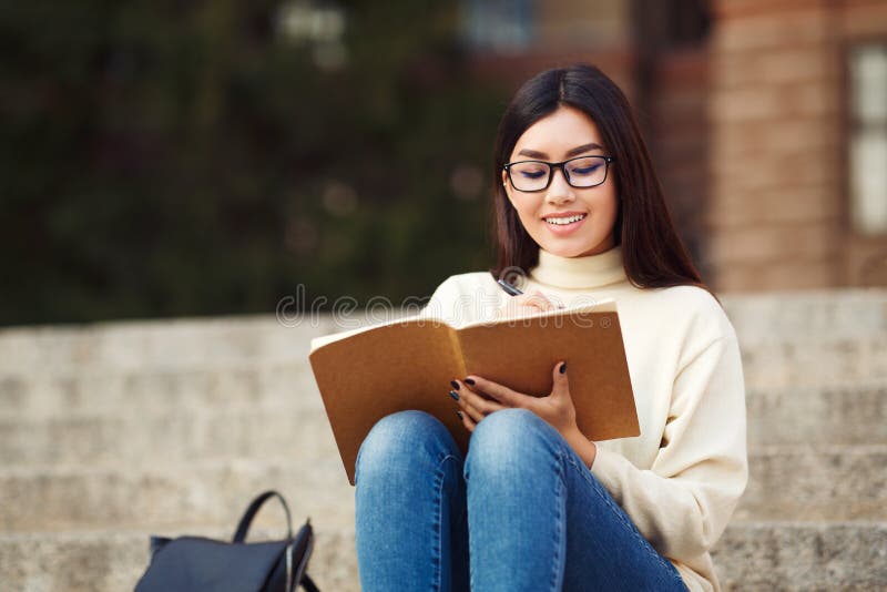 Young Girl Preparing for Lecture in Campus Stock Photo - Image of ...