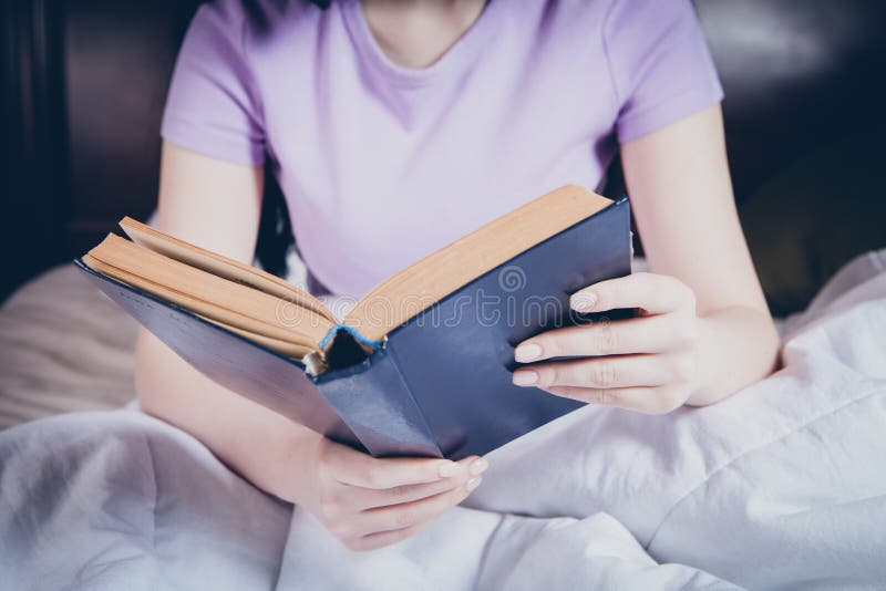 Young Girl Reading a Book in Bed Stock Photo - Image of light, morning ...