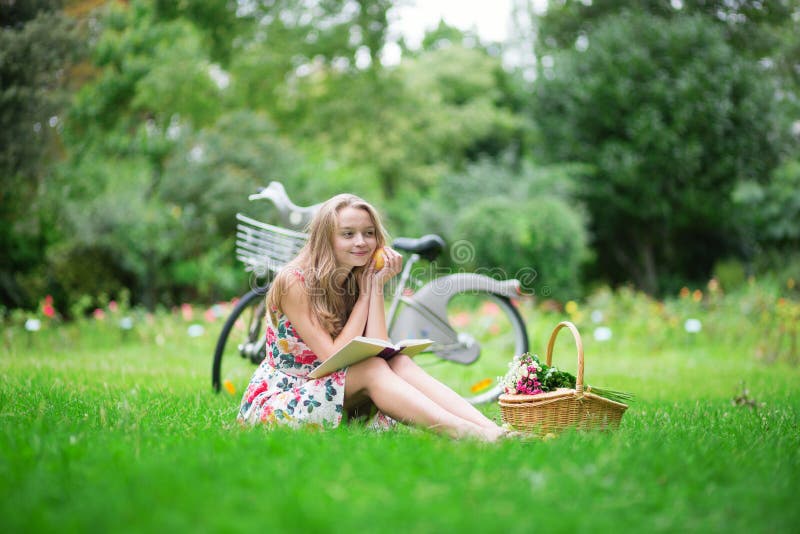 Young Girl Reading a Book in the Countryside Stock Image - Image of ...