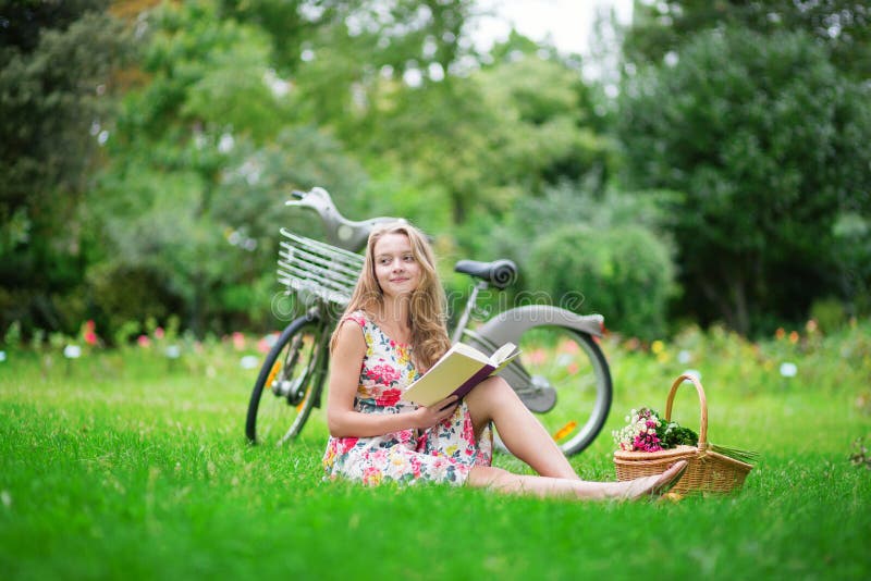 Young Girl Reading a Book in the Countryside Stock Photo - Image of ...