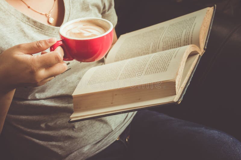 Young Girl Reading a Book and Drinking Coffee Stock Image - Image of ...