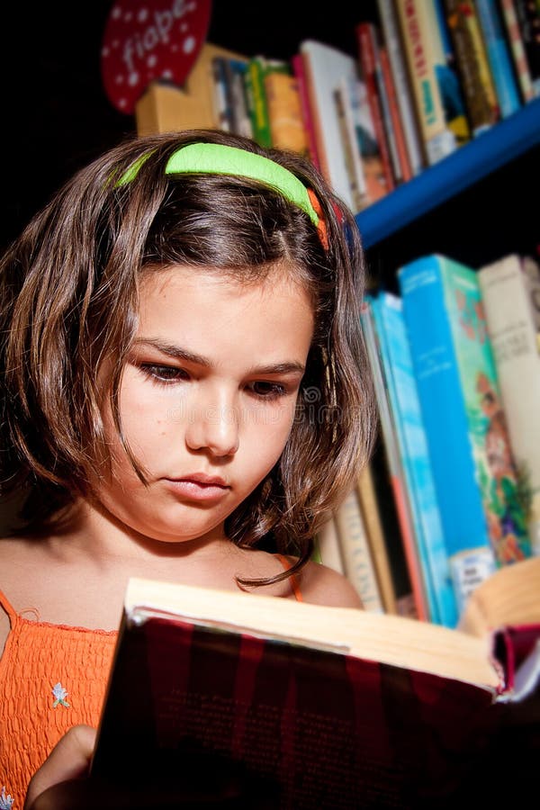 Young Girl Reading in Library Stock Image - Image of little ...