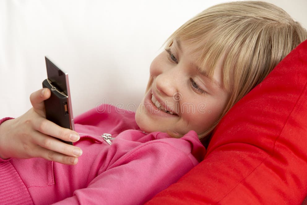 Young Girl Reading Text Message Stock Image - Image of caucasian ...