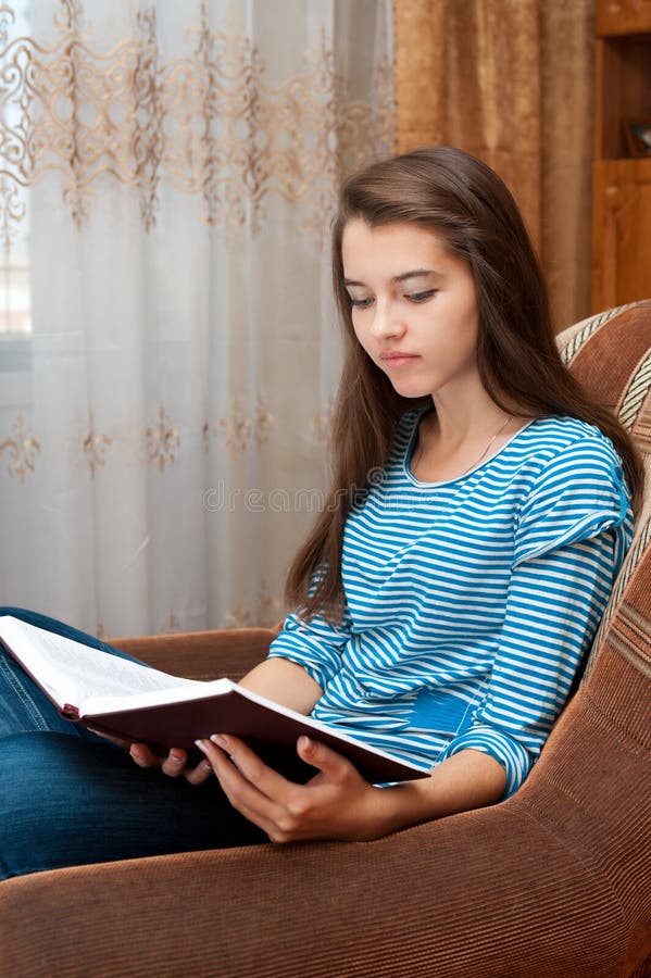 Young girl reads book stock image. Image of girl, hobby - 21815005