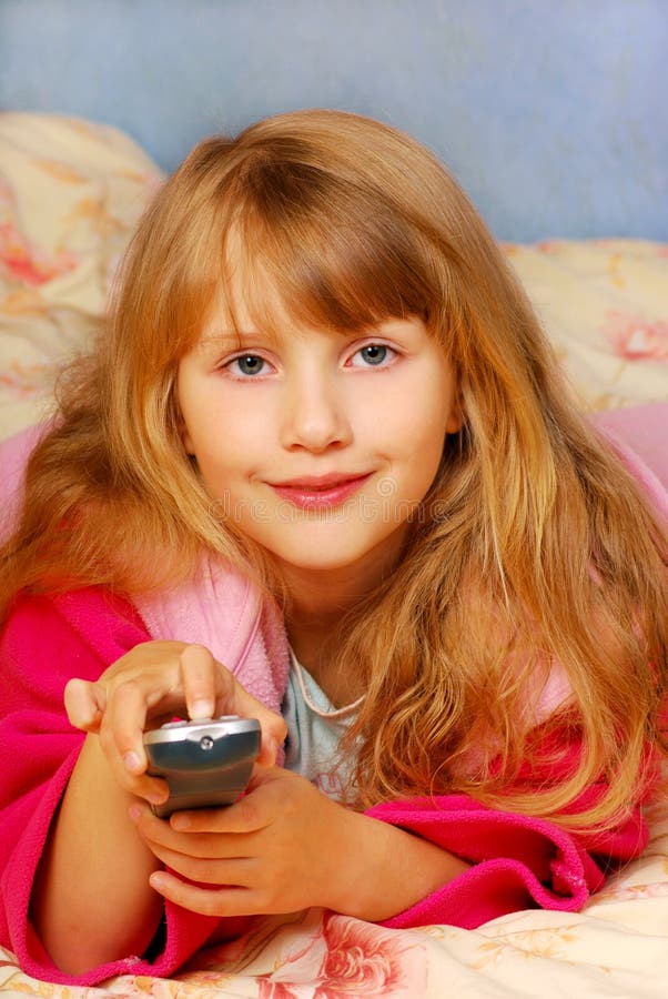 Young Girl with Remote Control in Hand Stock Image - Image of film ...
