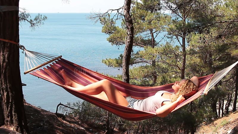 Young Girl Resting in a Hammock Stock Video - Video of attractive ...