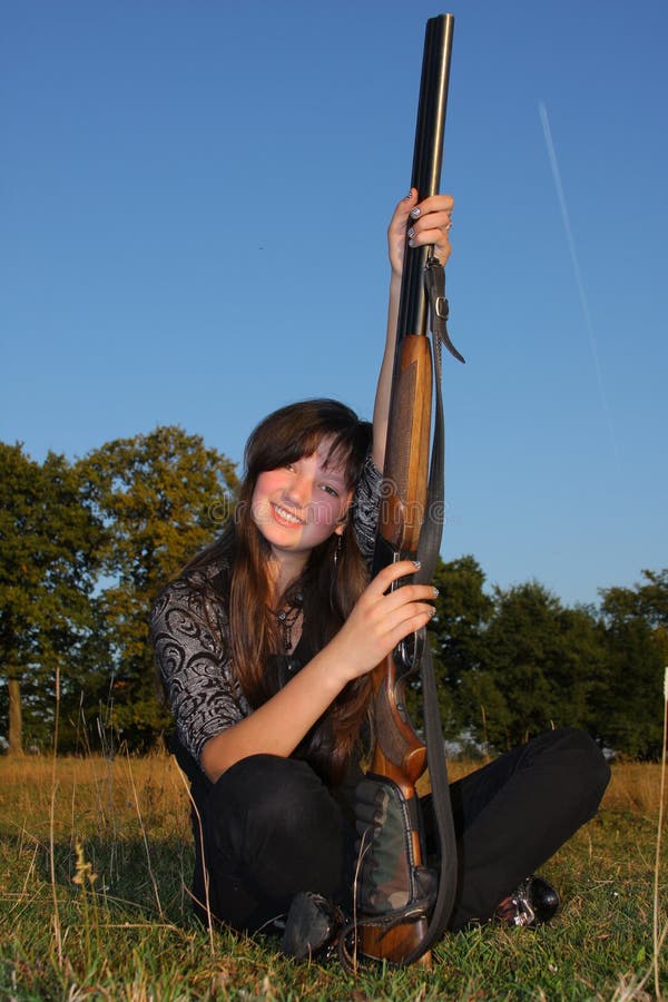 Young girl with rifle stock photo. Image of happiness - 12343296