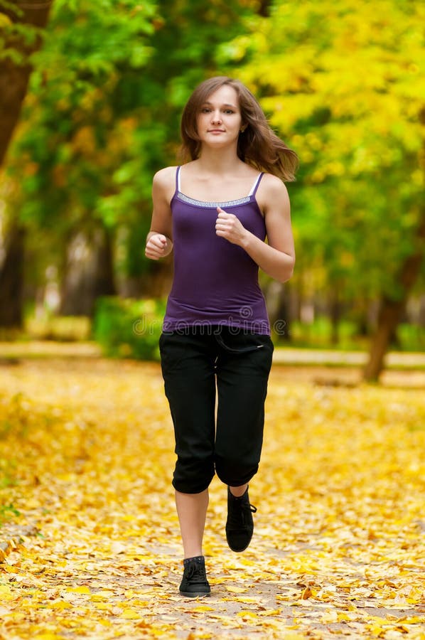 A Young Girl Running in Autumn Park Stock Image - Image of nature ...