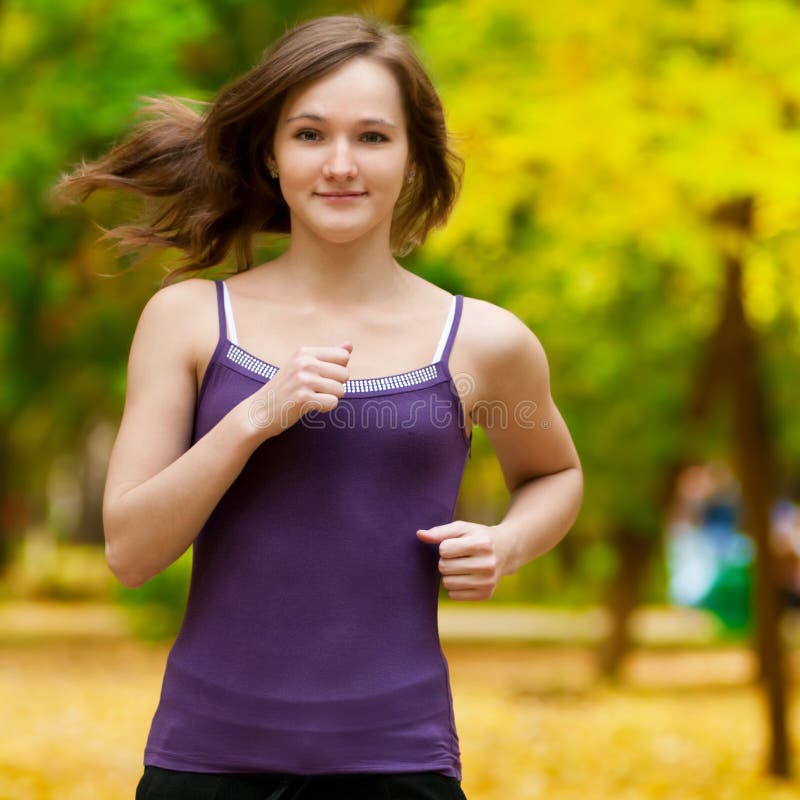 A Young Girl Running in Autumn Park Stock Photo - Image of crosscountry ...