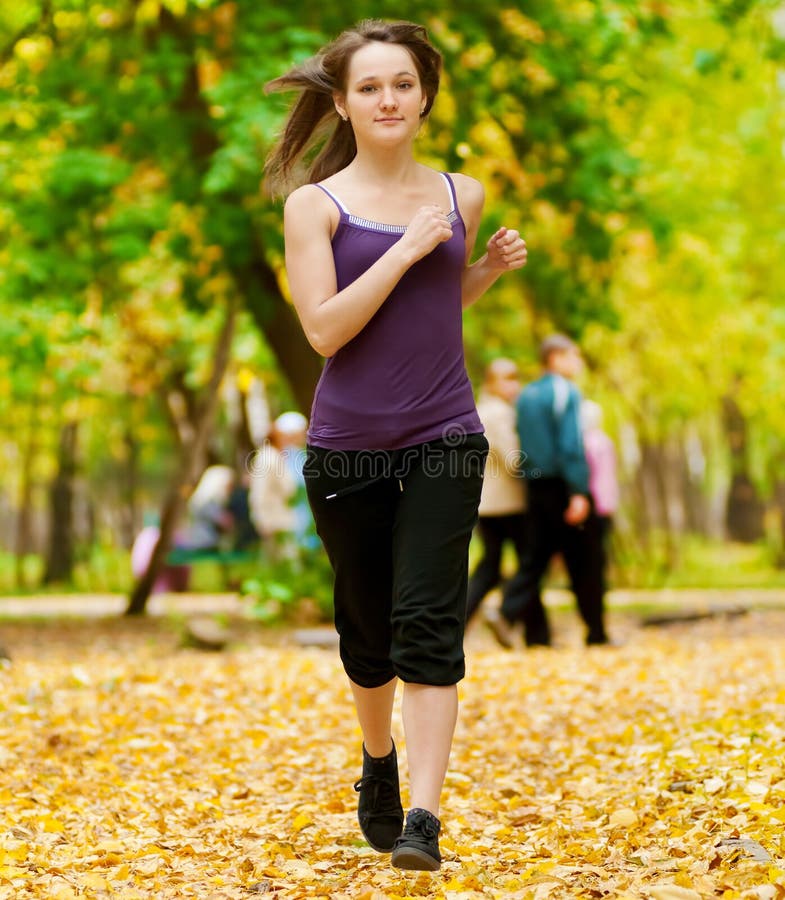 A Young Girl Running in Autumn Park Stock Photo - Image of girl, park ...