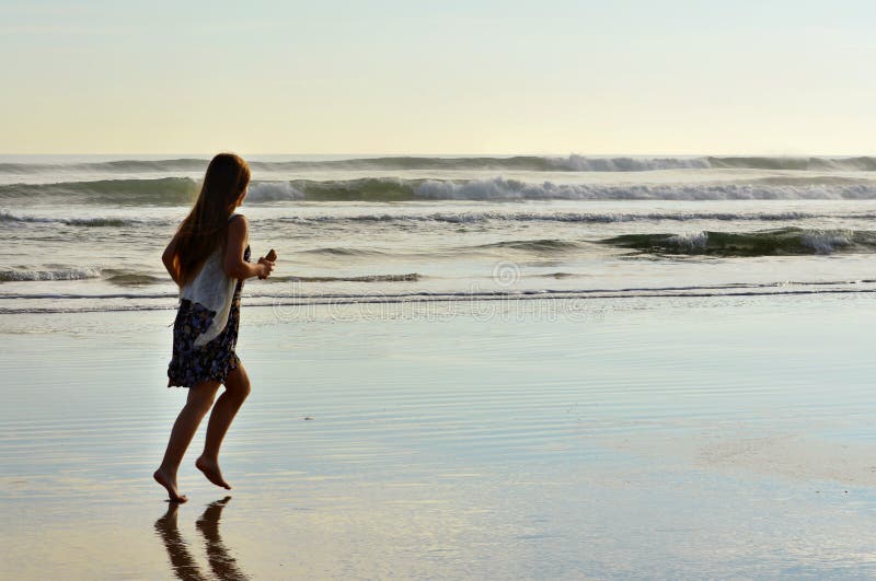 Young Girl Running on the Beach. Stock Photo - Image of beautiful ...