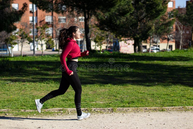 Young Girl Running in the Park in Early Spring Stock Photo - Image of ...