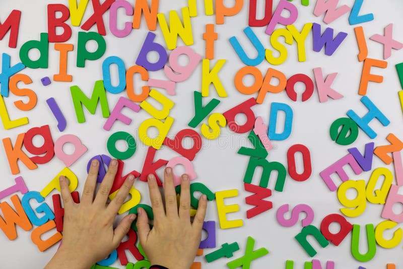 Young Girl`s Hands Sorting Alphabet Magnets on Whiteboard Stock Photo ...