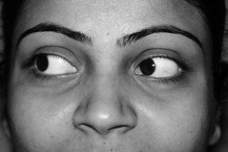 A Young Girl S Face Emerging from a Dark Background Stock Photo - Image ...